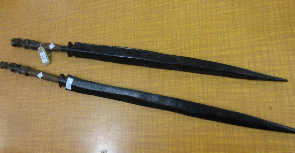 Two African native carved hardwood ceremonial swords