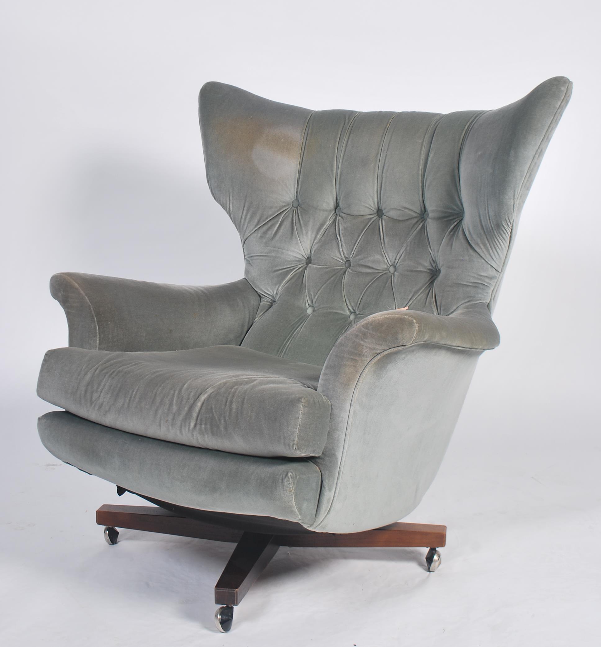 An original 1960's believed Parker Knoll black Batwing swivel chair ...