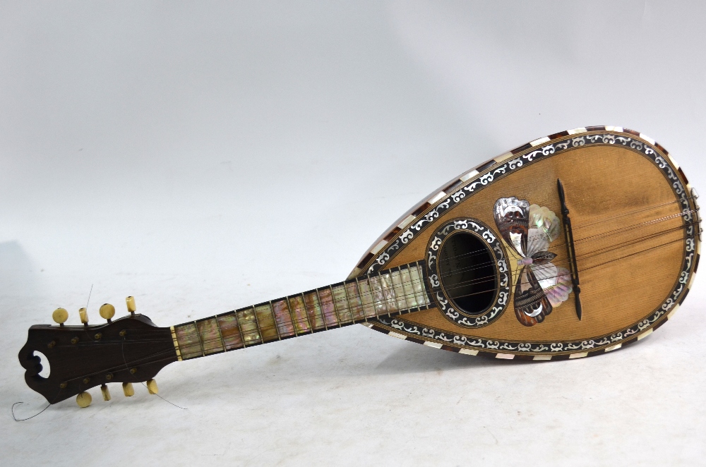 An Italian rosewood mandolin inlaid with mother of pearl and ...