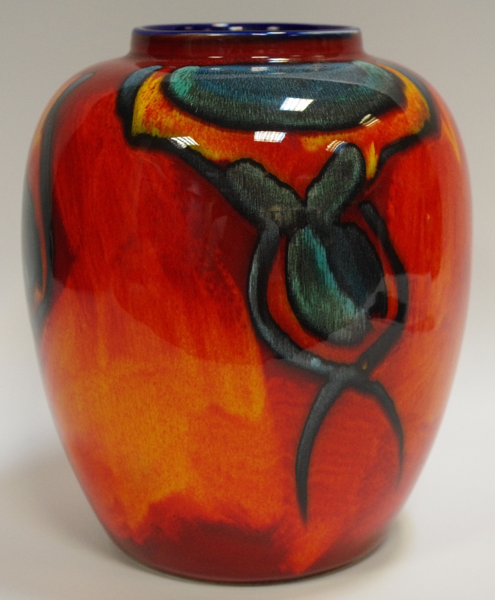A Poole pottery ovoid vase, red, orange, blue glazed, cobalt blue interior