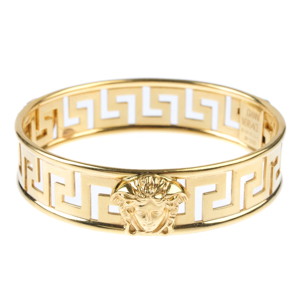GIANNI VERSACE - a bangle. Of openwork design, the Greek key motif with ...