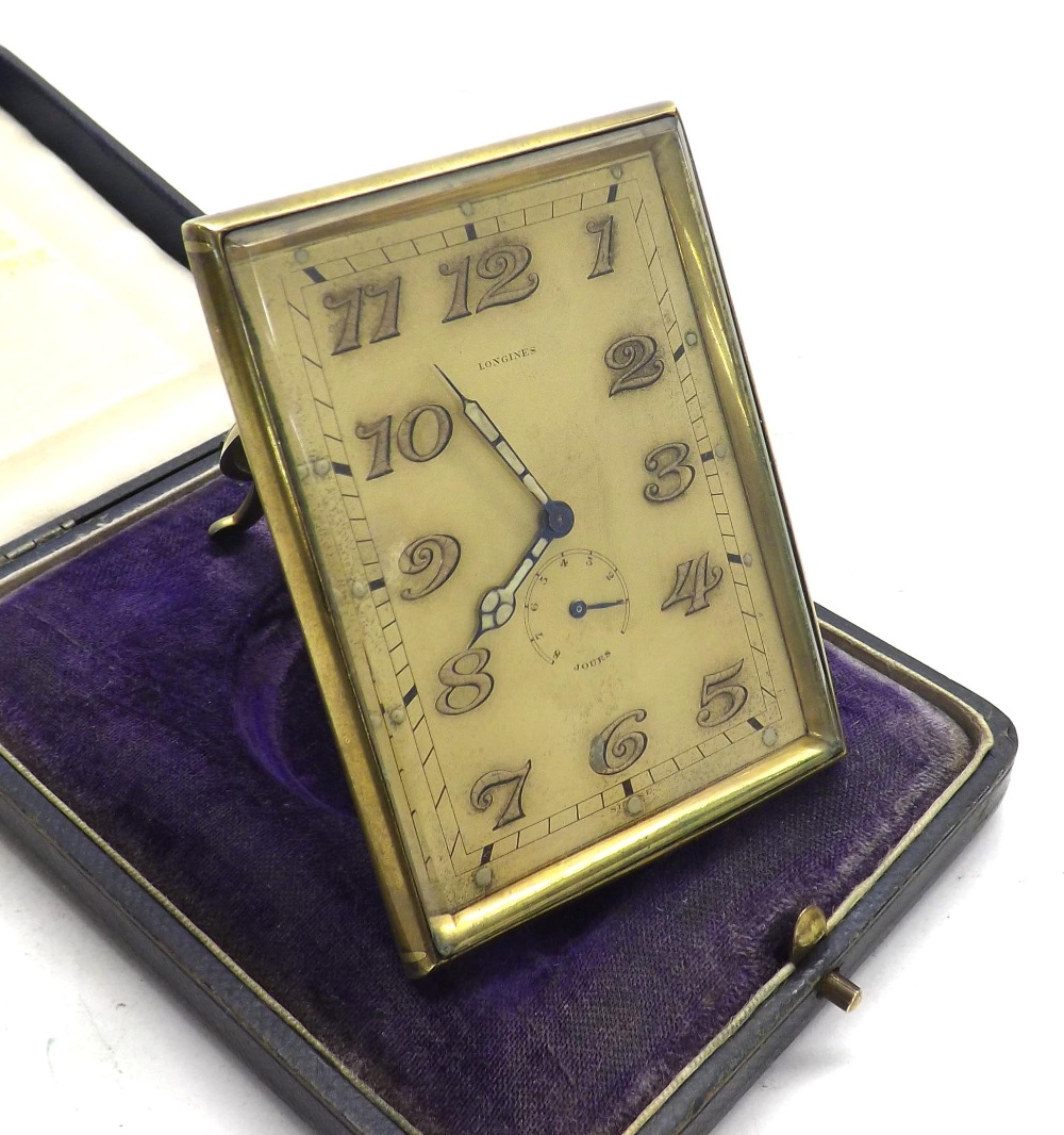 Longines gilt metal easel travel clock, the rectangular gilt dial with ...