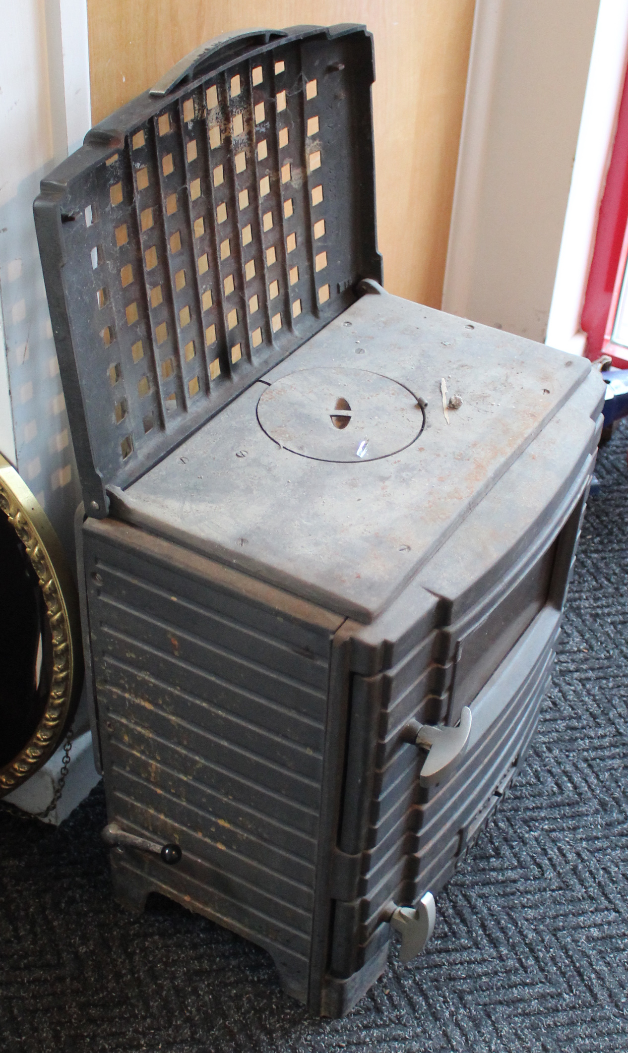 A Chappee wood-burning stove (No. 8033), in cast iron case, 19” wide x ...