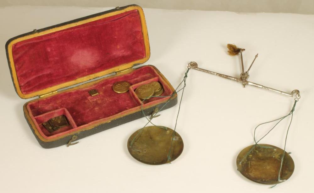 A PAIR OF LATE 18TH CENTURY COIN SCALES, with steel beam and gilt metal ...