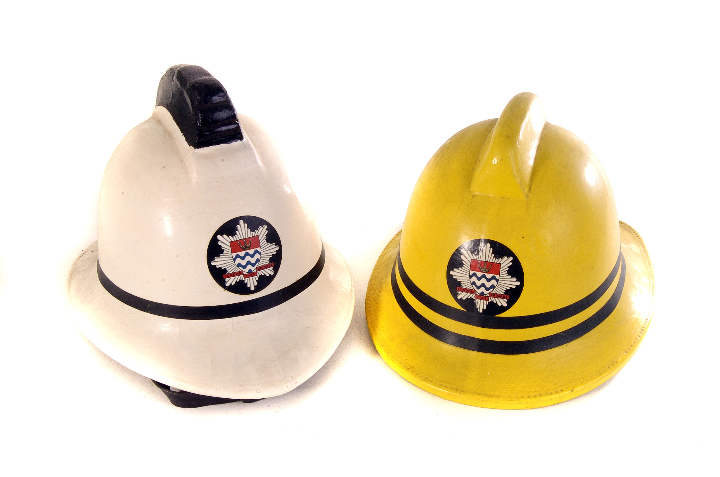 A vintage London Fire Brigade Station Officers fire helmet, together ...