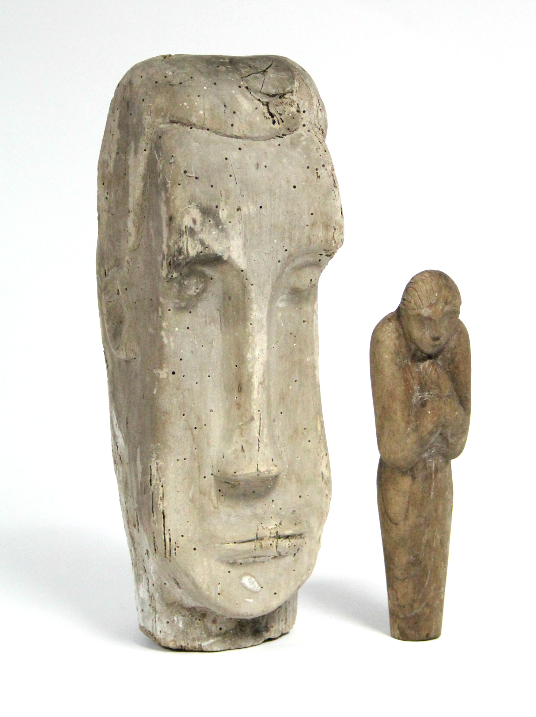 An ethnic carved wood stylised human head, 13” high (w.a.f.); & another ...
