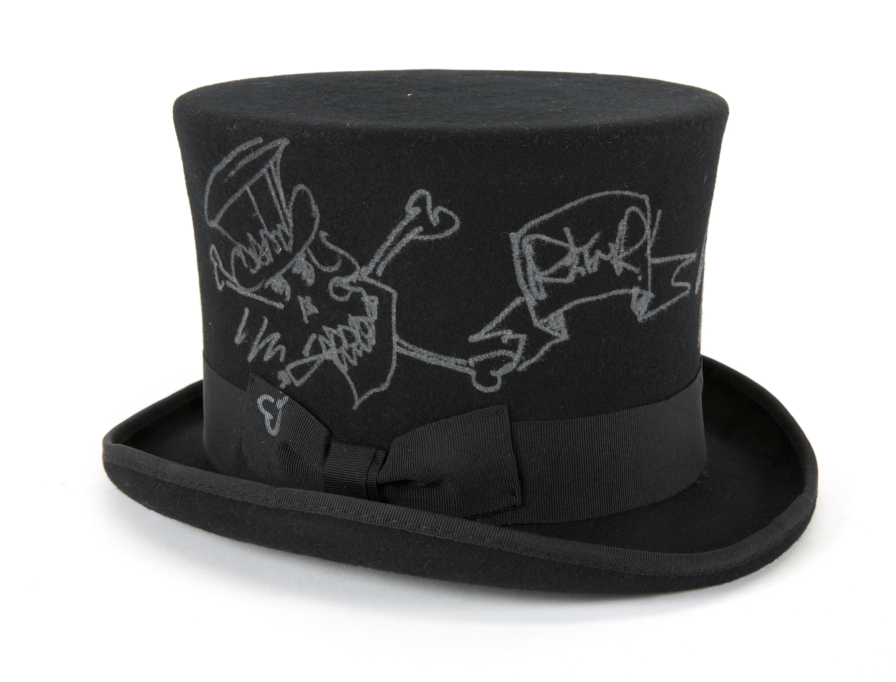 A black felt top hat signed "Slash 2016" in silver marker, with a skull ...