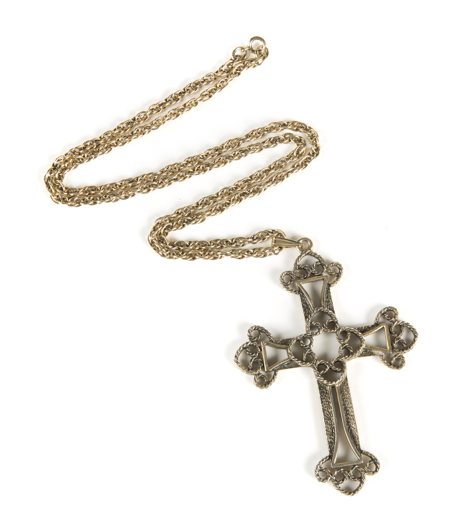 An Elvis Presley worn and gifted cross necklace. Presley was presented ...