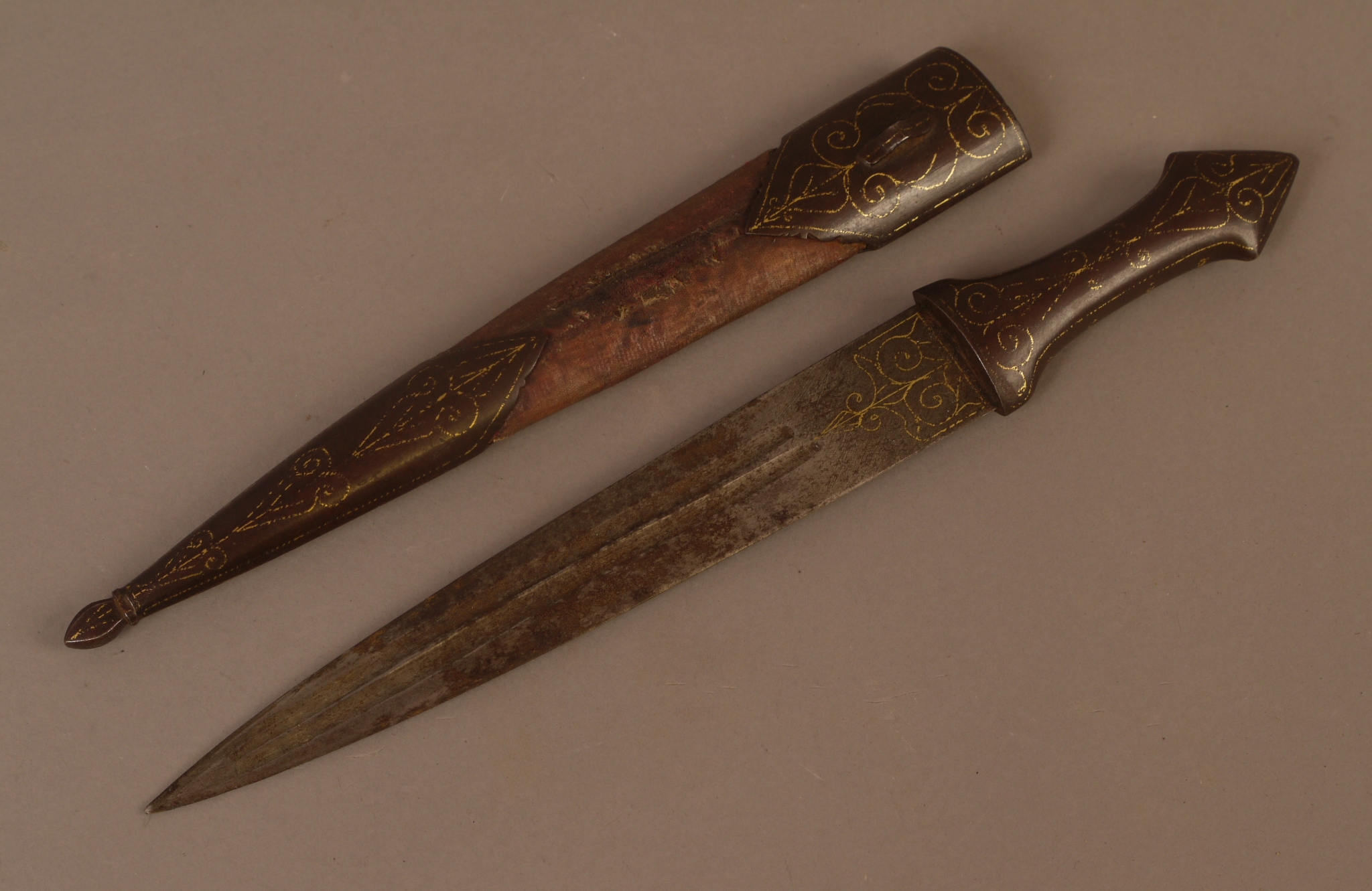 AN 18TH CENTURY EASTERN DAGGER with iron grip, throat and tip, each ...