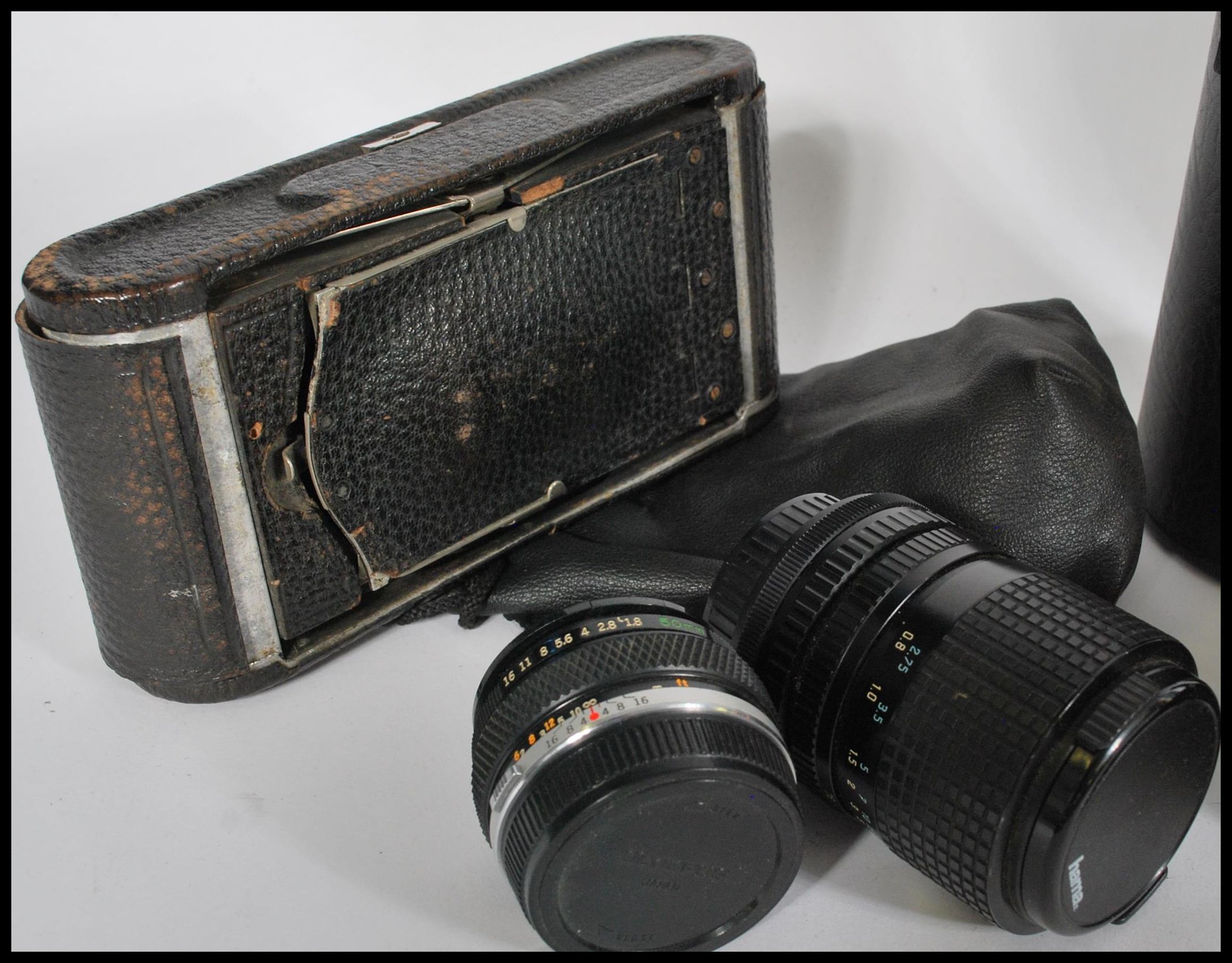 A collection of vintage 20th Century cameras and lenses to include a ...