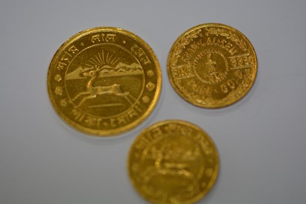 Three Indian gold coins, 1 Tola and two 1/2 Tolas (3), each stamped ...