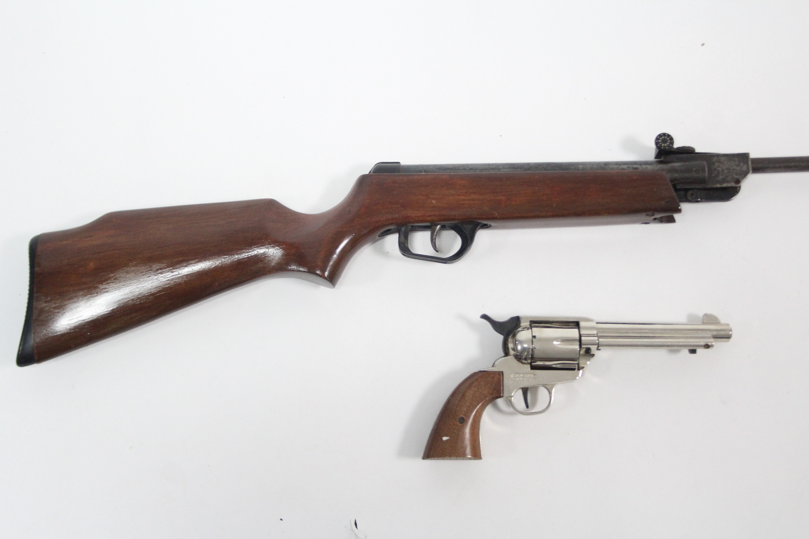A Spanish .22 calibre air rifle; & a replica revolver.