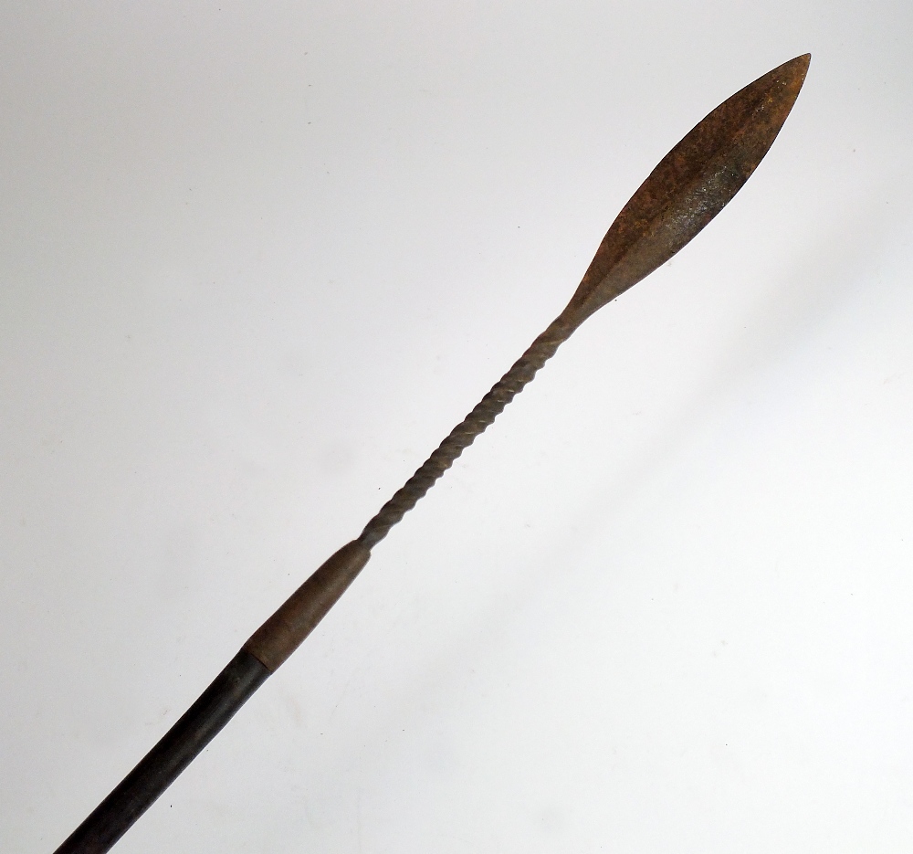 A 19th century East African spear with twisted shaft and copper binding ...