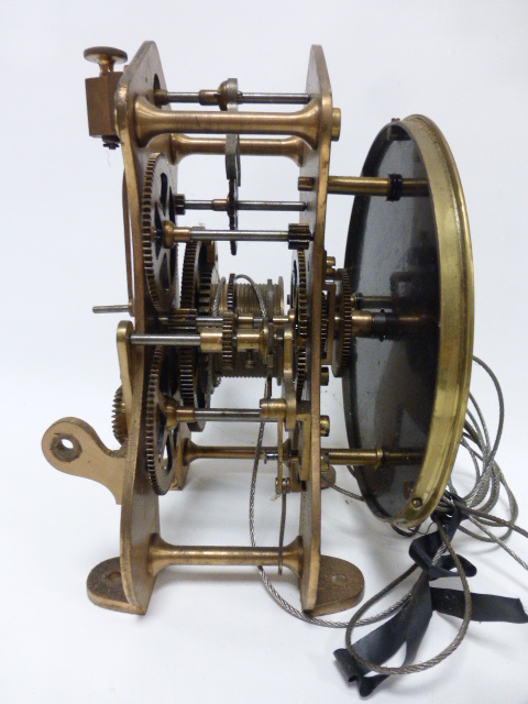 The British Pitometer Co brass clock movement, No. 523, with 18.5cm ...