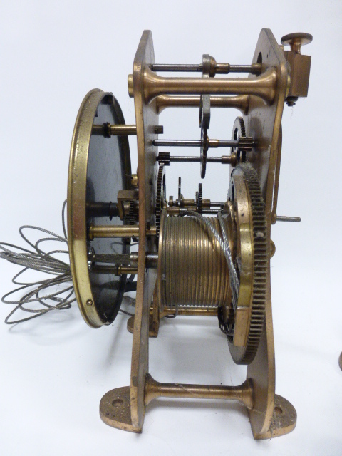 The British Pitometer Co brass clock movement, No. 523, with 18.5cm ...