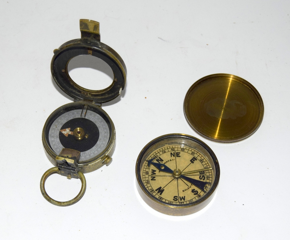 A WW1 Swiss made British Army marching compass dated 1915 and a brass ...