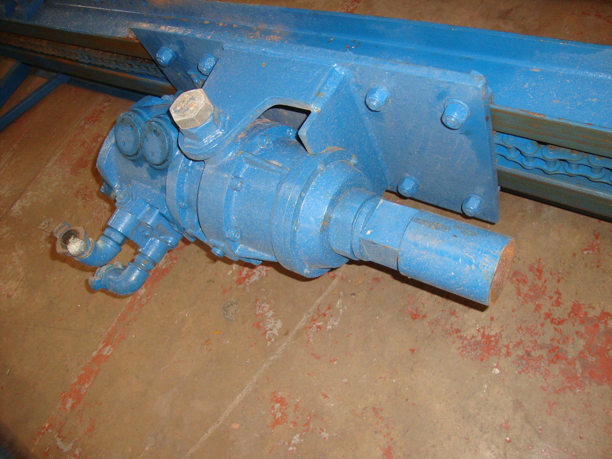 Complete drill feed system comprising pneumatic DTH rotation head ...