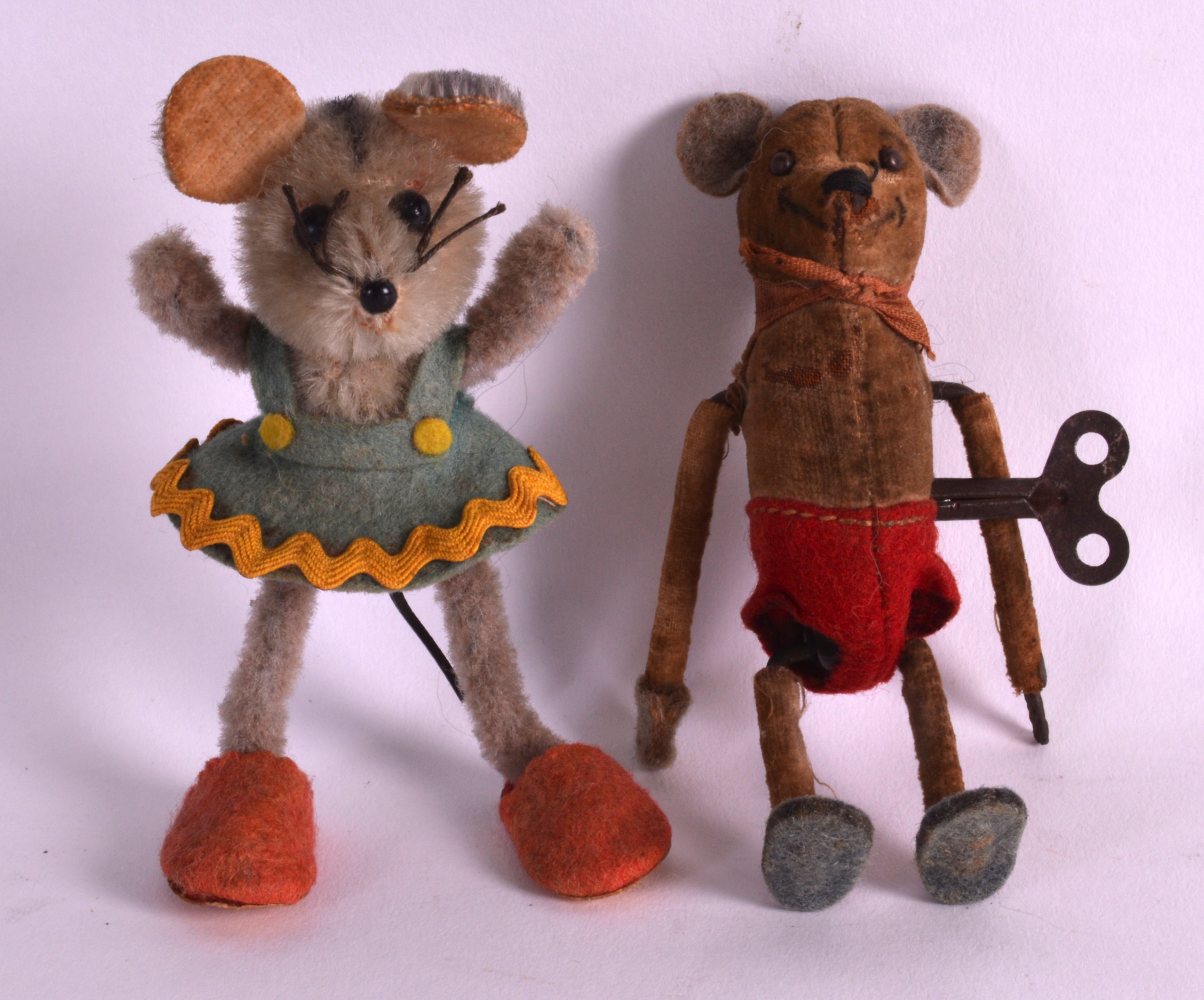AN EARLY 20TH CENTURY ENGLISH WIND UP MECHANICAL MOUSE together with ...