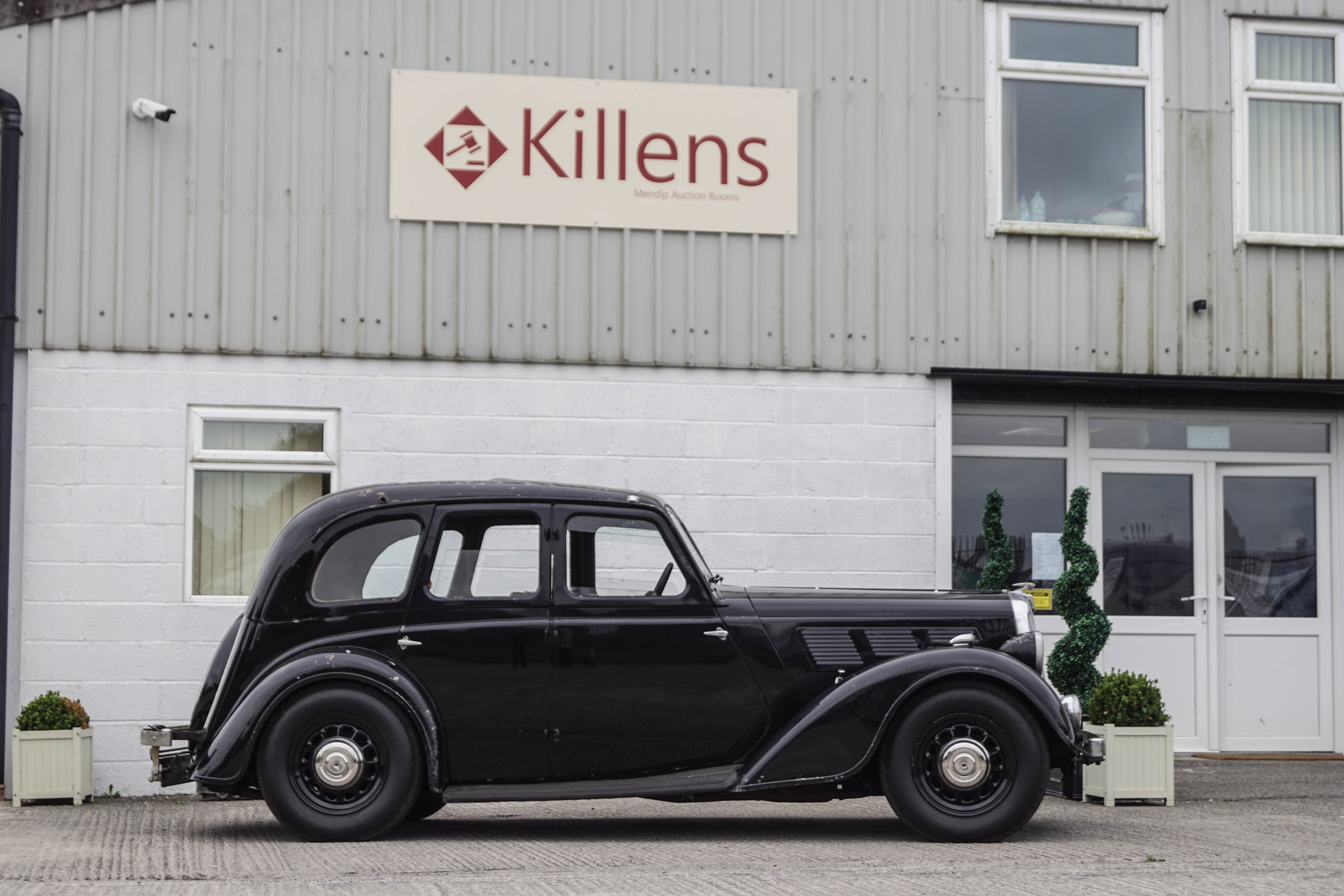 A Series III 1938 Morris 14/6 saloon with sunroof. The car bears its ...
