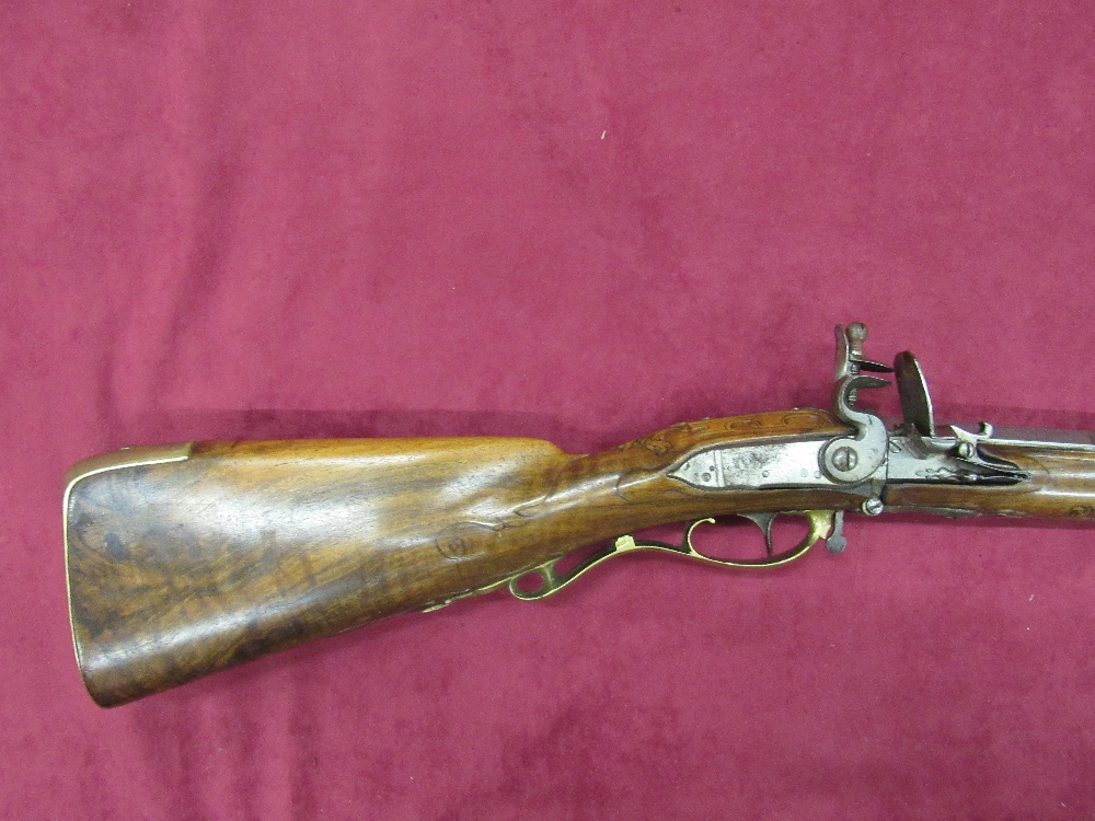 A very good large German breech-loading flintlock Musket, with carved ...