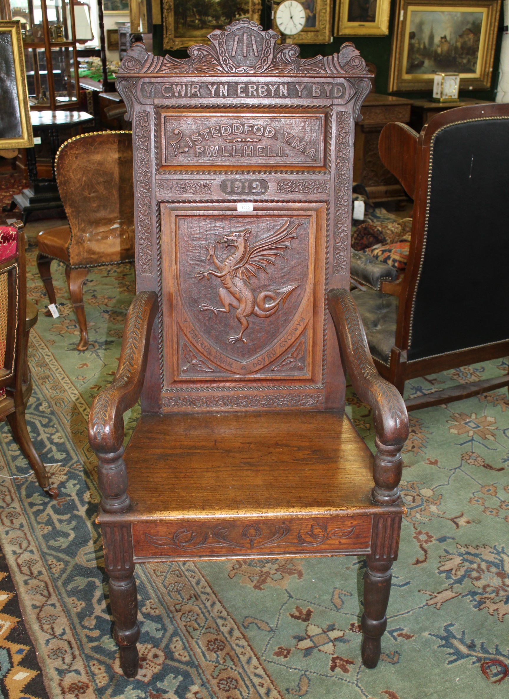 EISTEDDFOD CHAIR, PWLLHELI 1912 - WELSH INTEREST a large carved oak ...