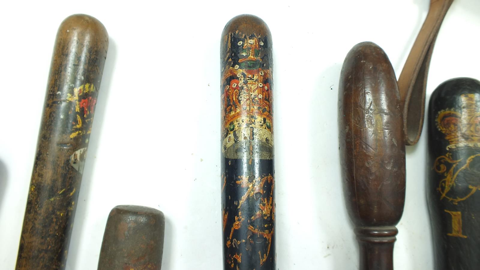 Eight various truncheons, to include painted examples and modern police ...