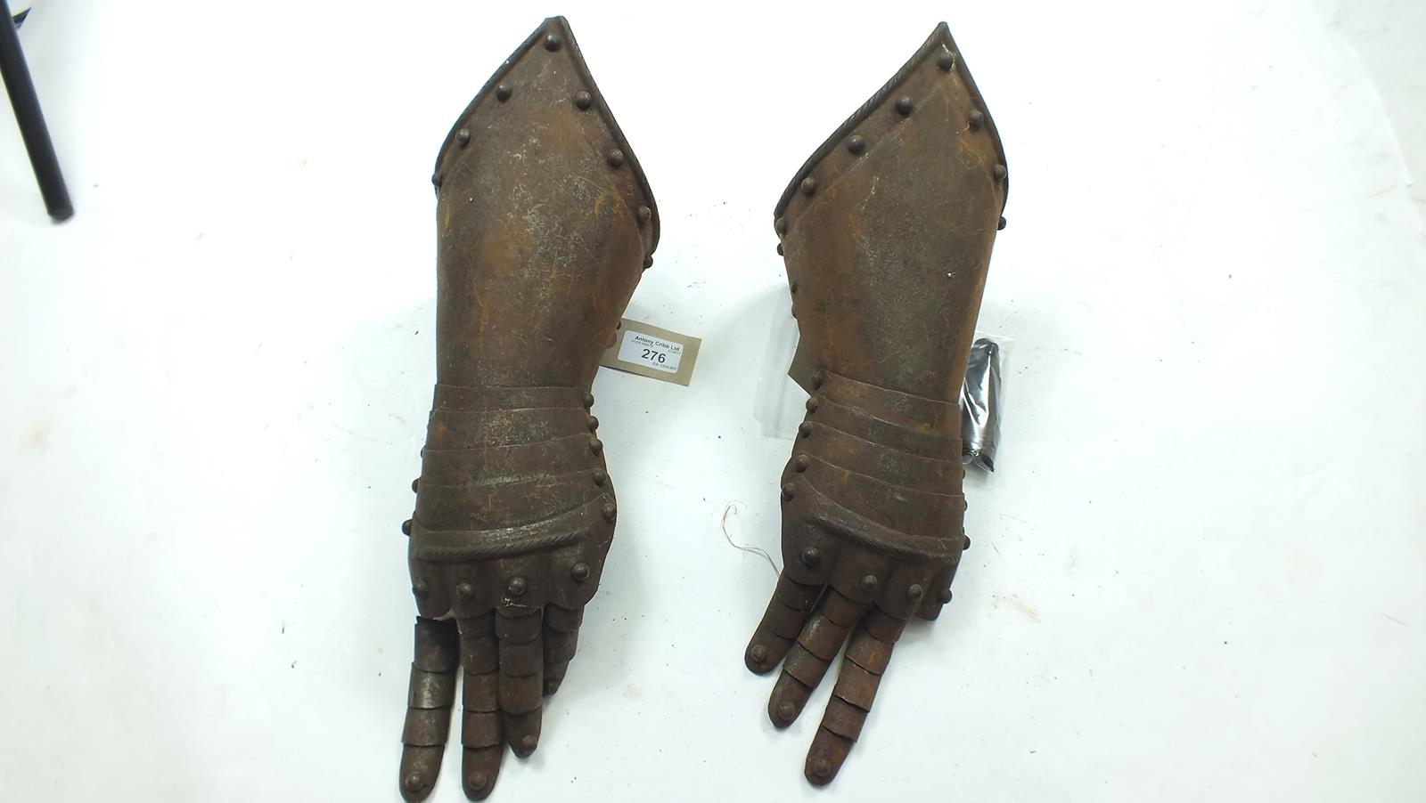 A pair of fingered gauntlets in the 16th Century style, each with fixed ...