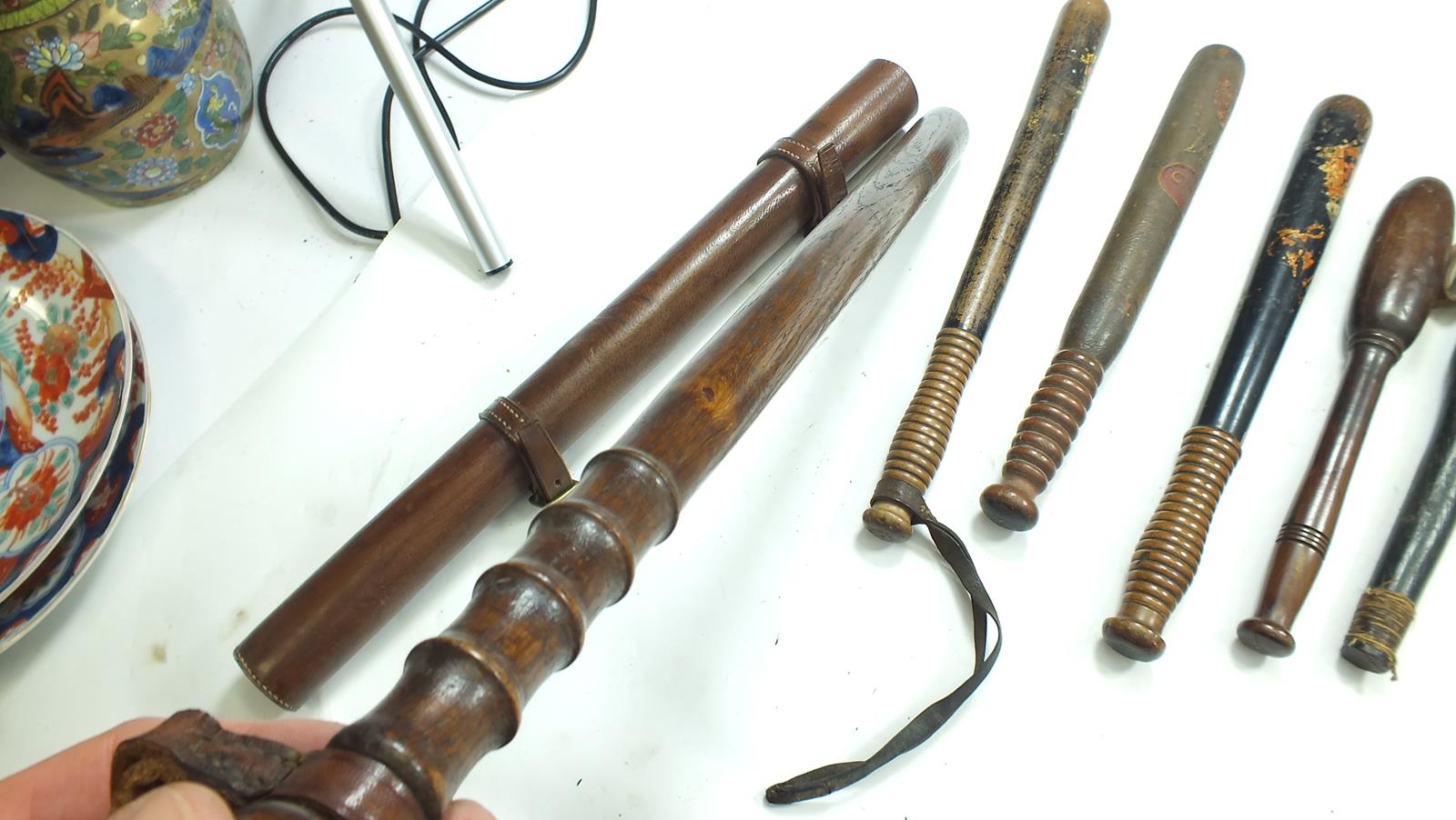 Eight various truncheons, to include painted examples and modern police ...