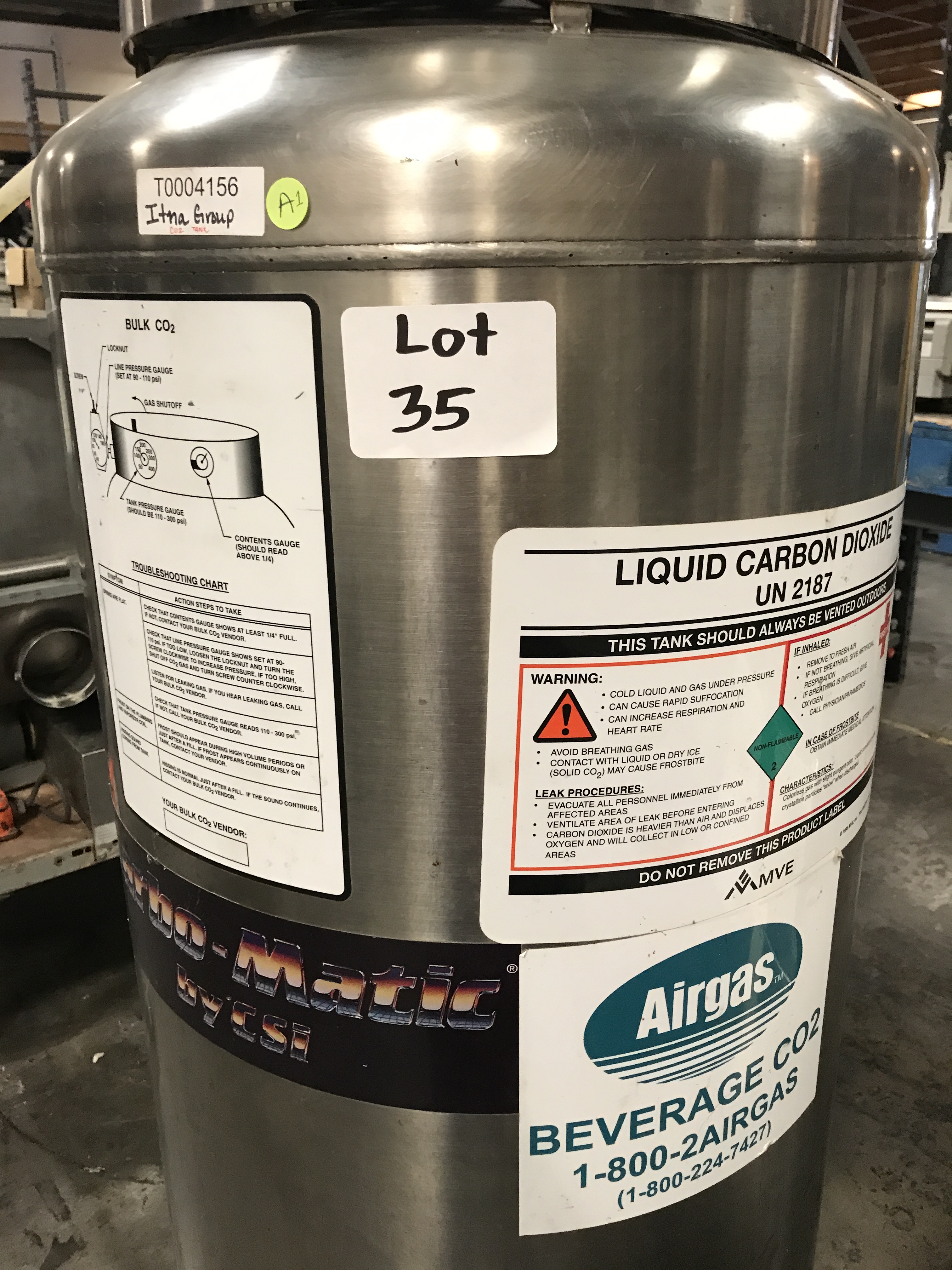 Stainless steel soda CO2 tank, approximately 5' tall