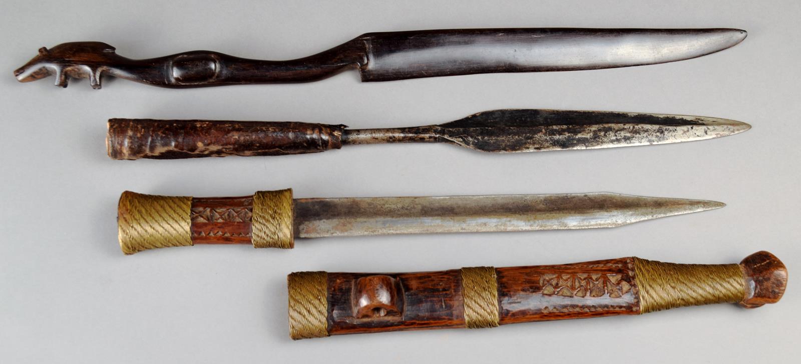 A Shona knife Zimbabwe wood, iron and brass wirework, the handle and ...