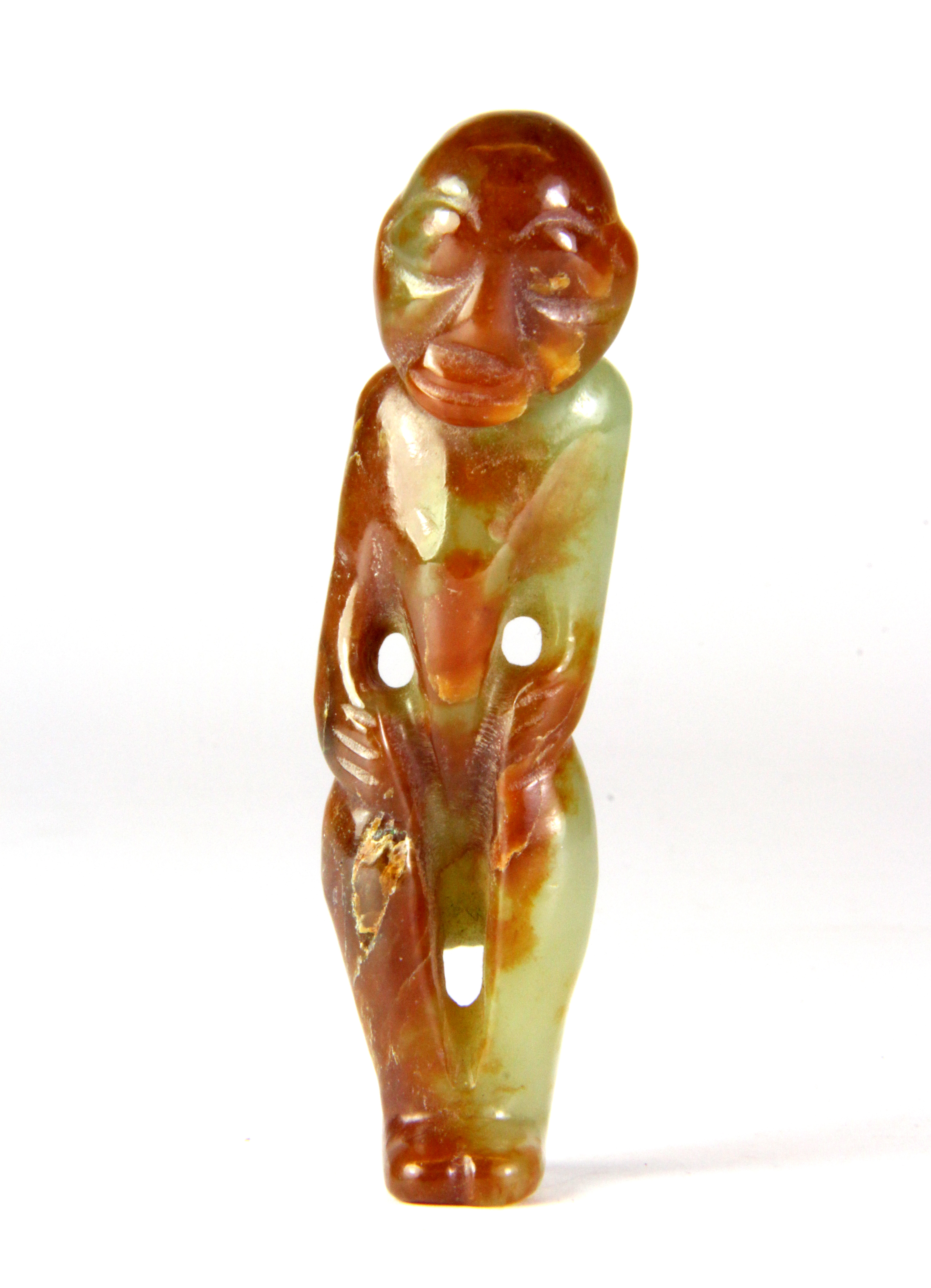 An interesting Japanese mixed colour jade figural netsuke, H. 8cm.