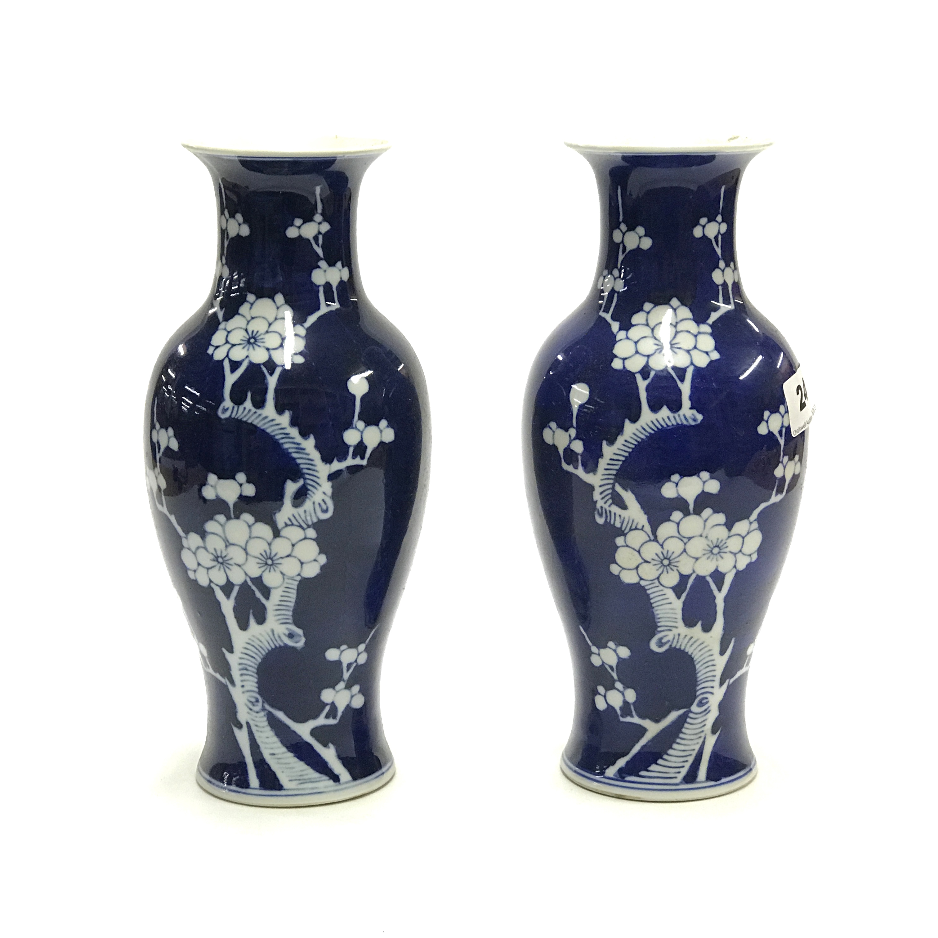 A pair of Chinese prunus design hand painted porcelain vases, H. 25cm.