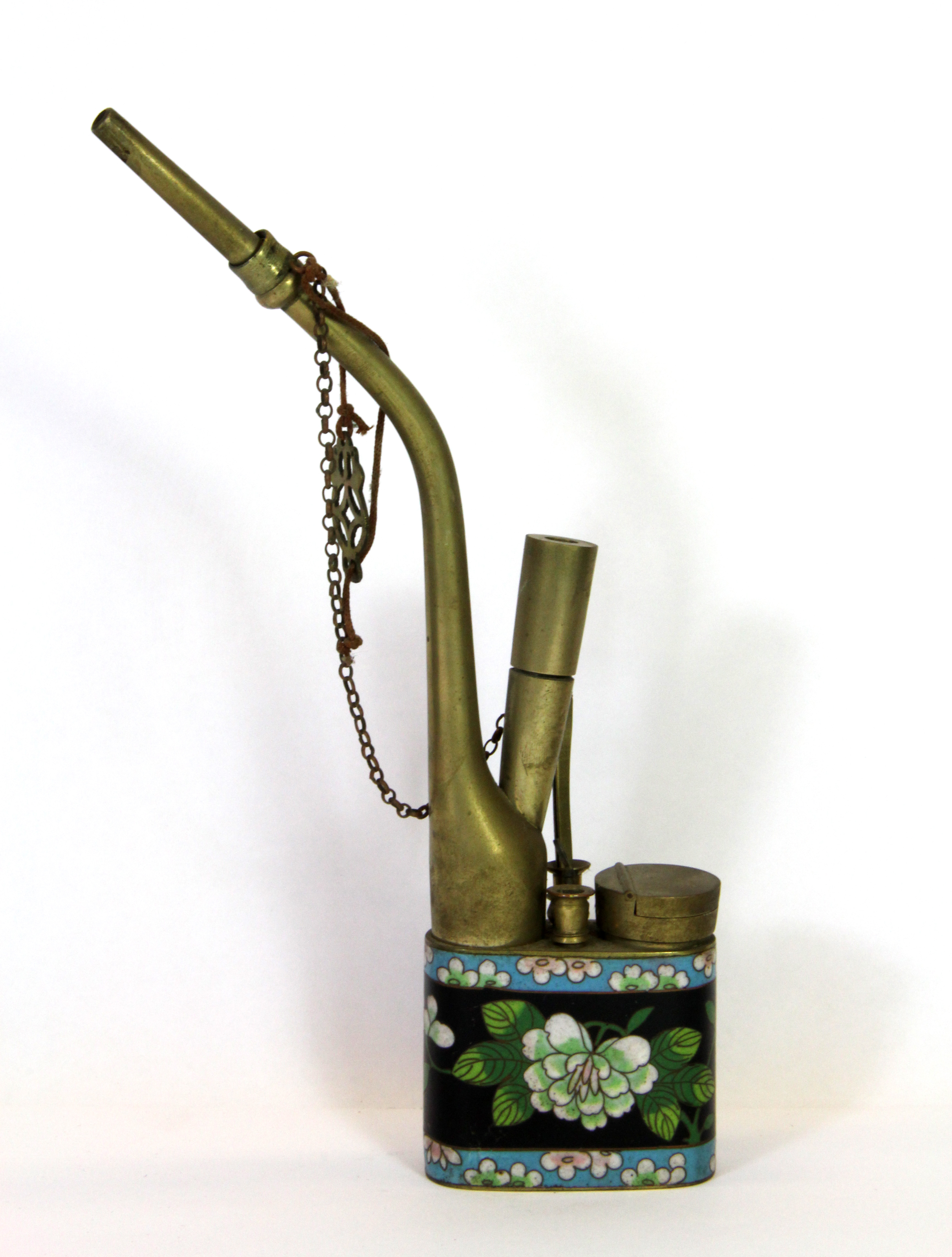 An early 20th century Chinese cloisonné enamelled opium pipe, H. 27cm.