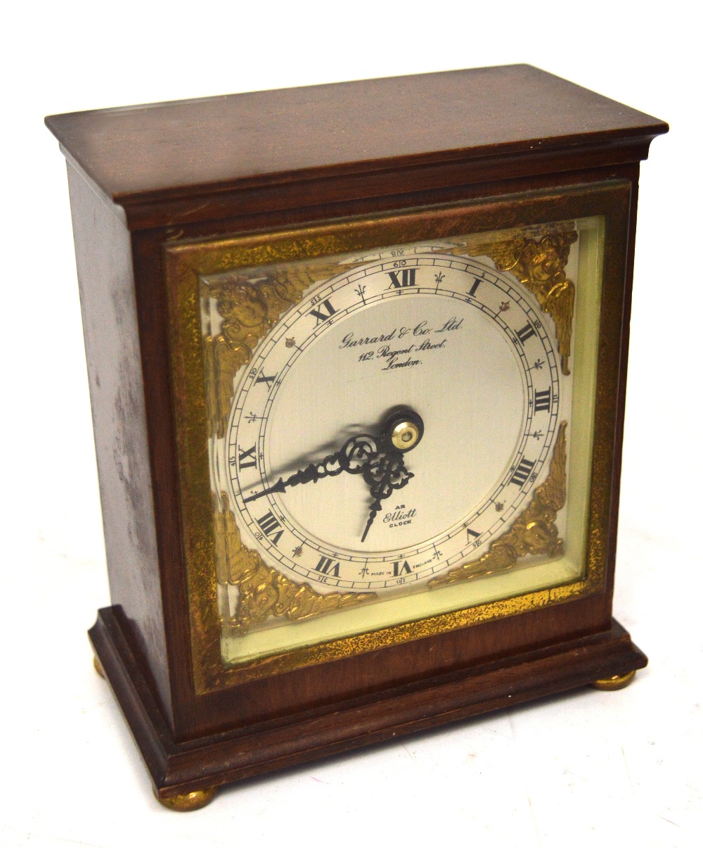 Garrard & Co Ltd; an Elliott clock, silvered dial set with Roman ...