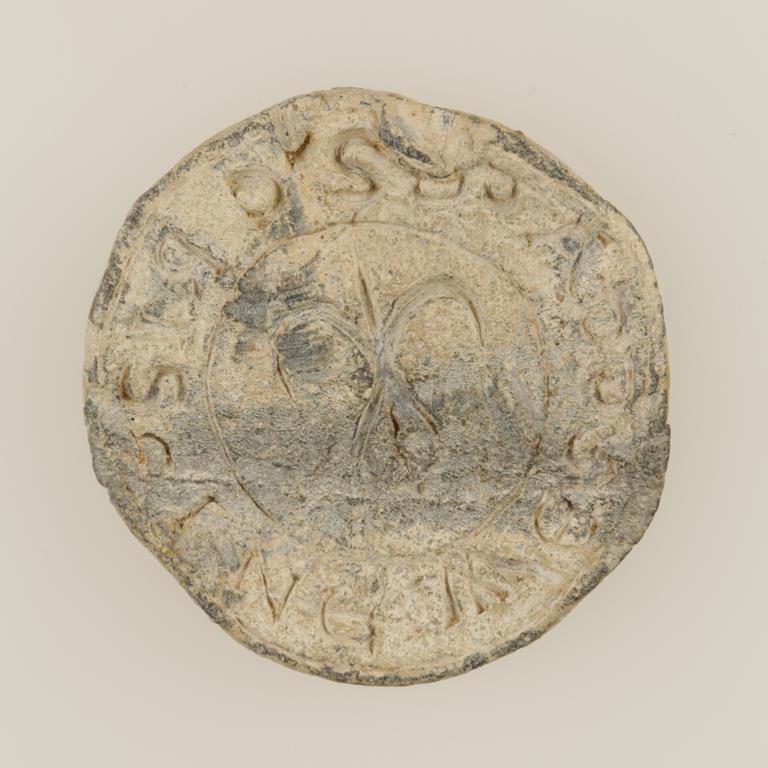 A MEDIEVAL LEAD SEAL MATRIX, the seal with a central design within a ...