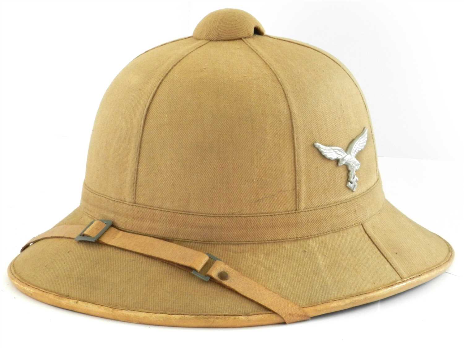 A German Third Reich Luftwaffe pith helmet formed of six panels, the ...