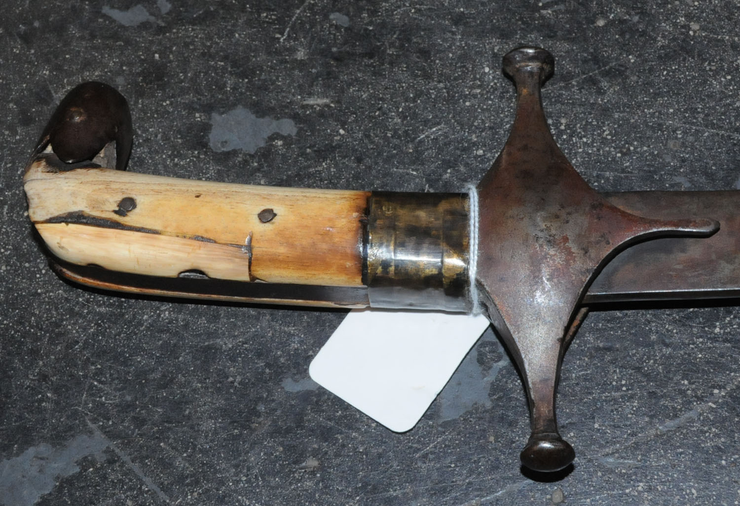 An antique Arabian Scimitar, with bone handle and decorated blade ...