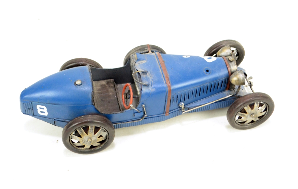 A tinplate model Bugatti vintage racing car in blue, length 36cm.