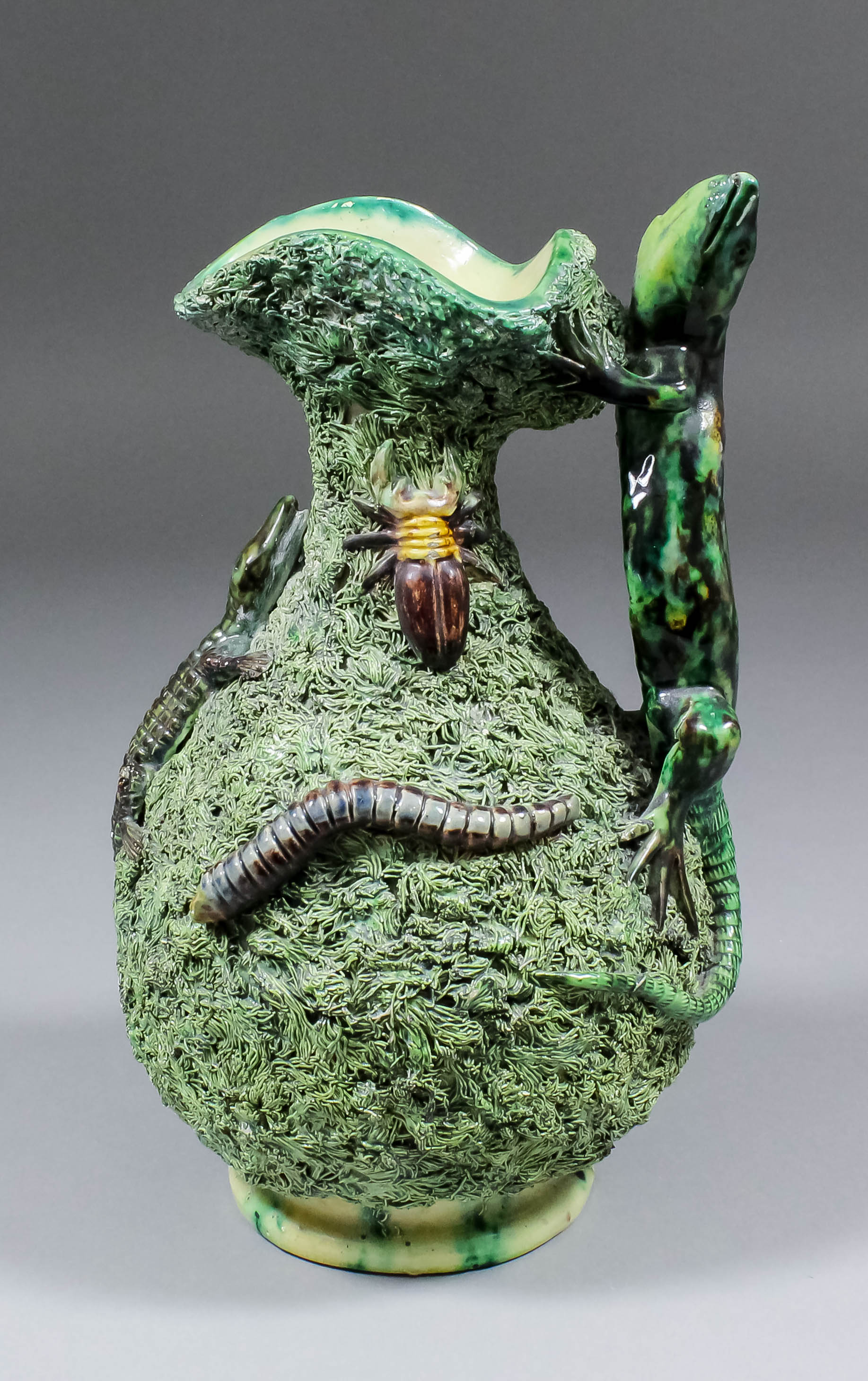A 19th Century "Palissy" pottery jug, the body modelled with insects ...
