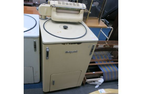 A vintage Hotpoint washer above two roll through wringer, with another ...