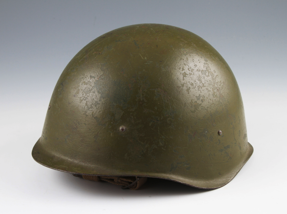 A Cold war Russian green helmet with liner, dated to interior 1948 A ...