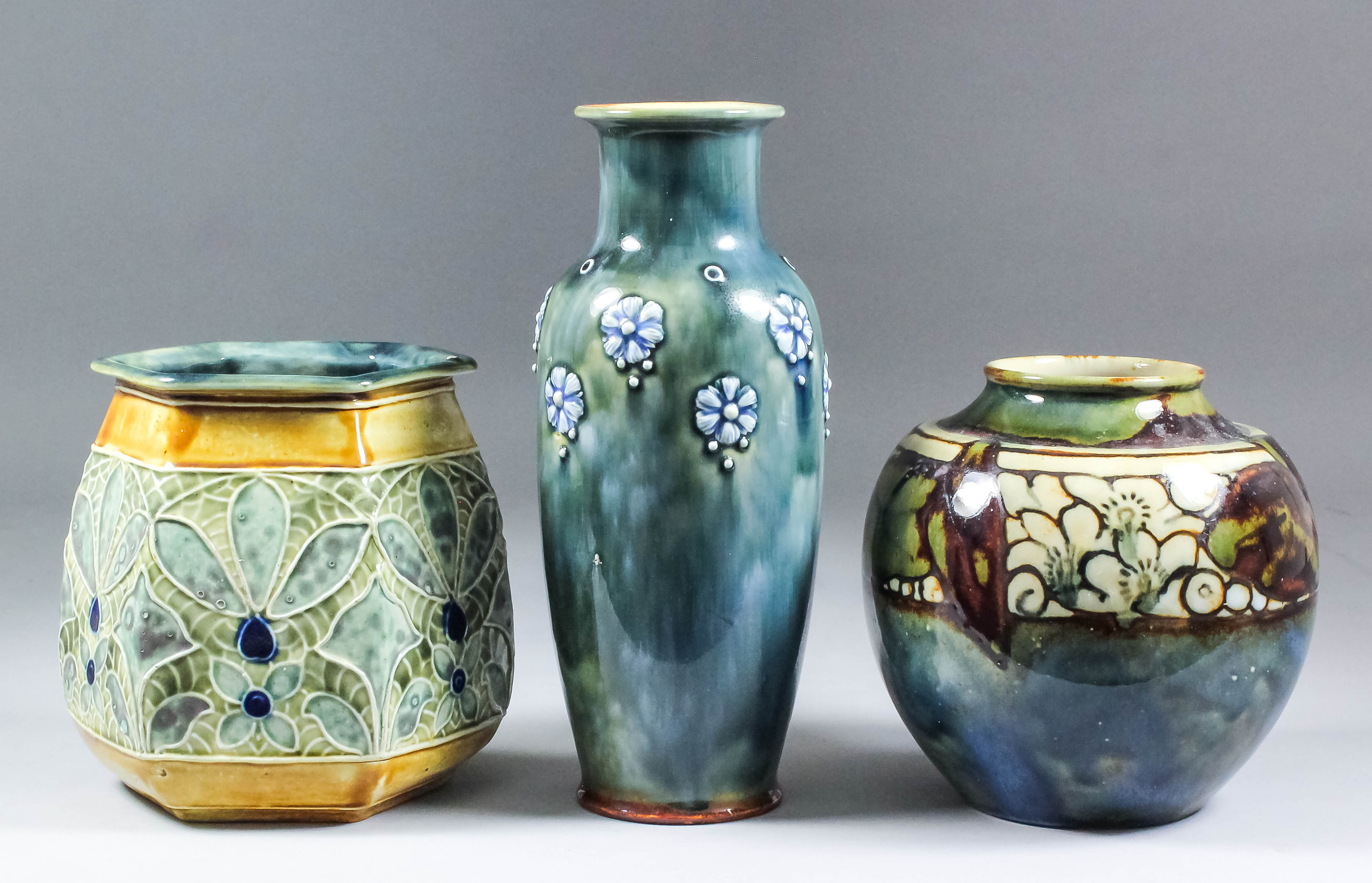 A Royal Doulton Lambeth pottery hexagonal vase, painted with stylised ...