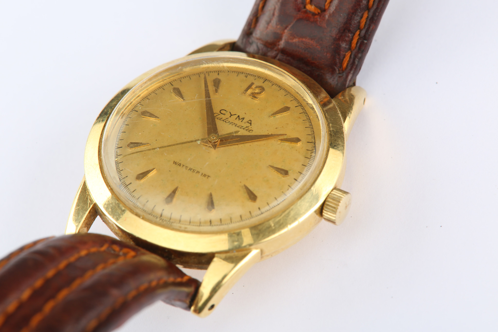 CYMA. AN 18K YELLOW GOLD AUTOMATIC WRISTWATCH.Date: Circa 1950 ...