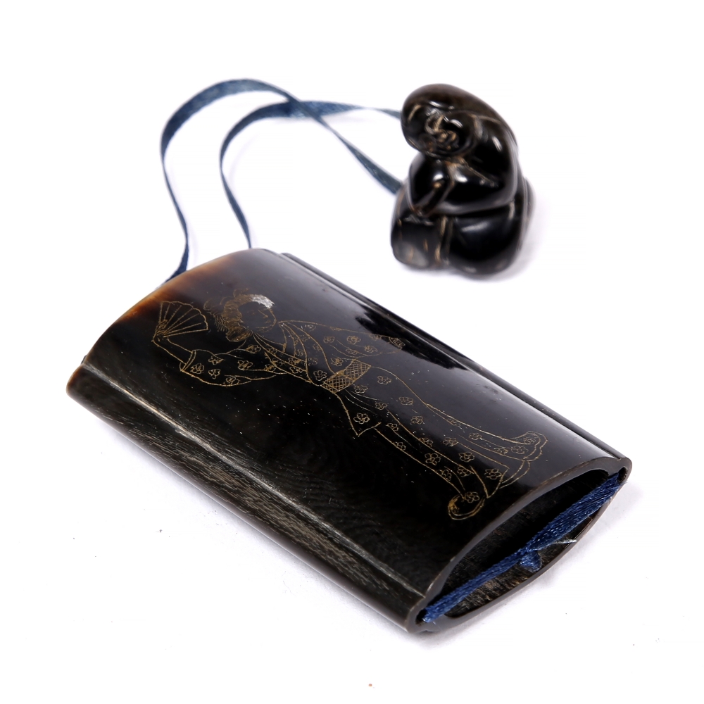 A Japanese horn inro Meiji period engraved to each side