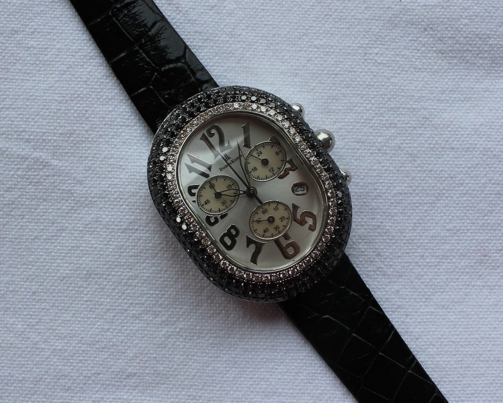 A Lady's Domoskenos wristwatch, the oval dial with Arabic numerals, and ...