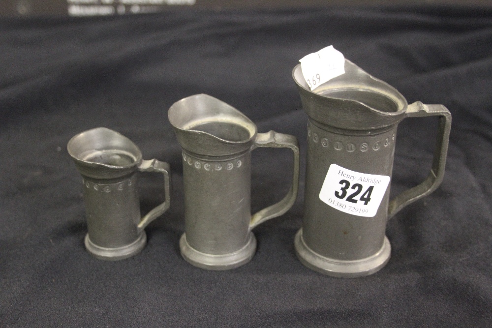 19th cent. Pewter: Dutch measuring jugs with Angel touch marks.