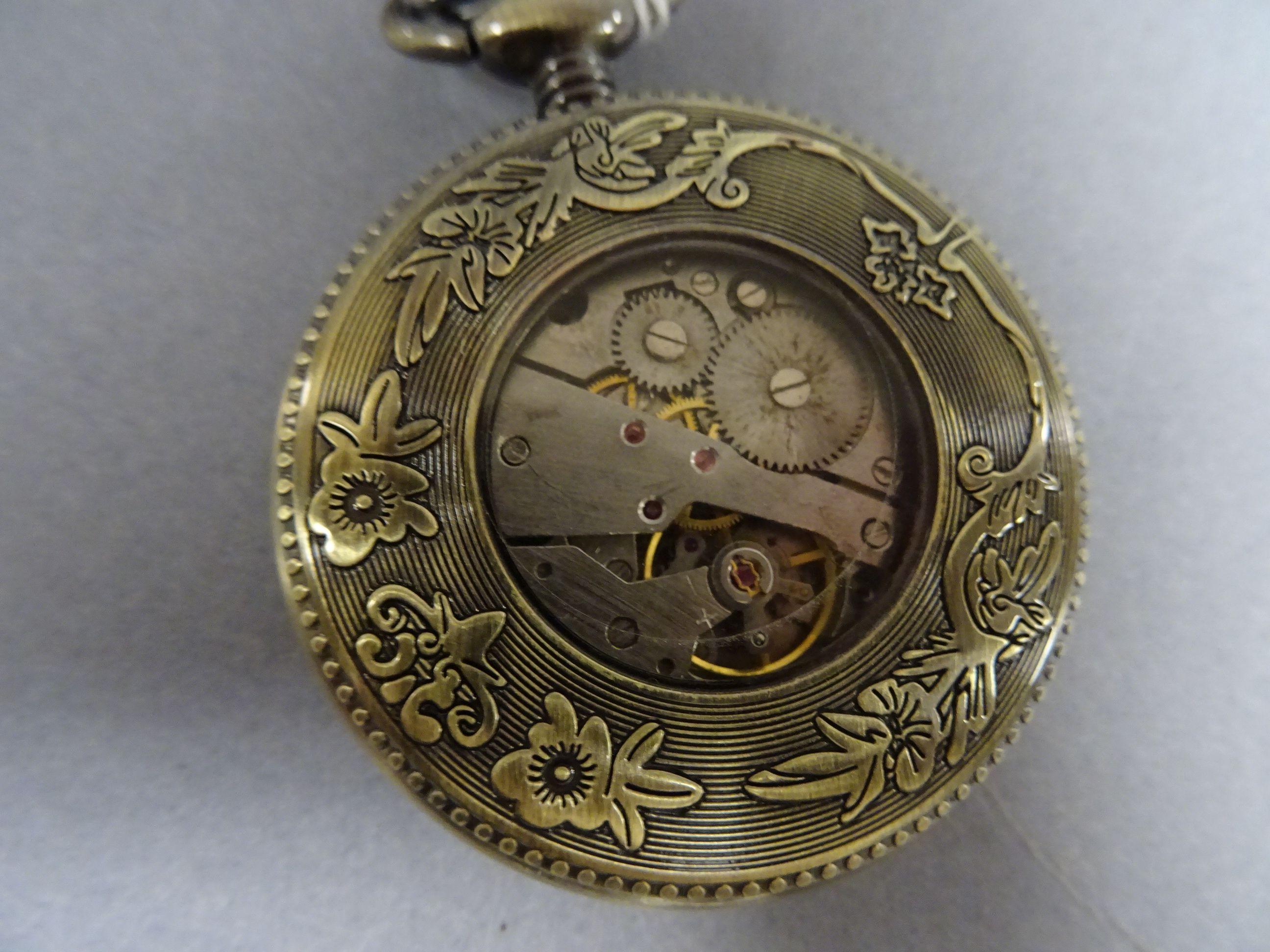 Pocket watch with medieval scene to front