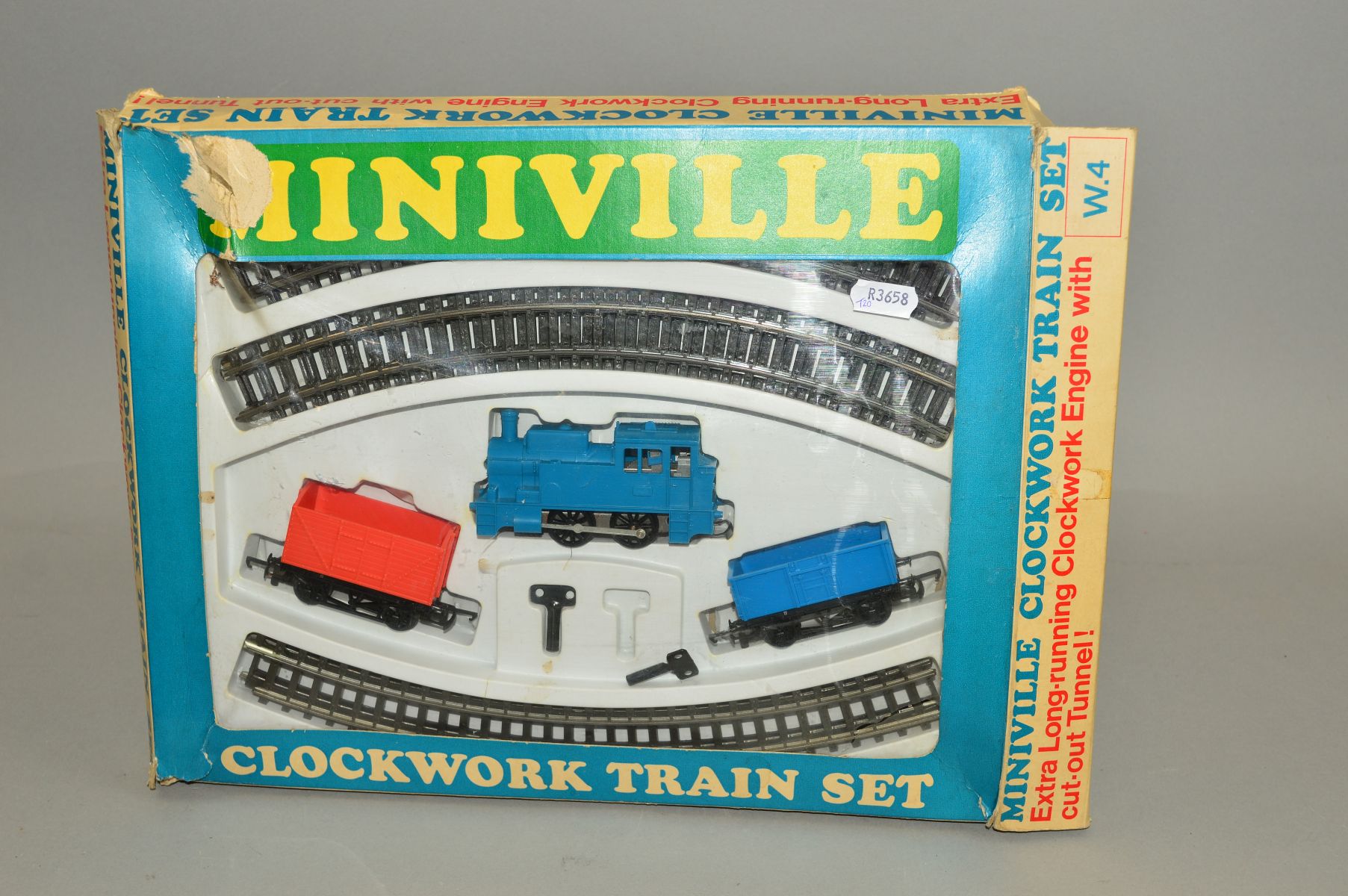 A BOXED TRI-ANG MINIVILLE OO GAUGE CLOCKWORK TRAIN SET, No.W.4 ...