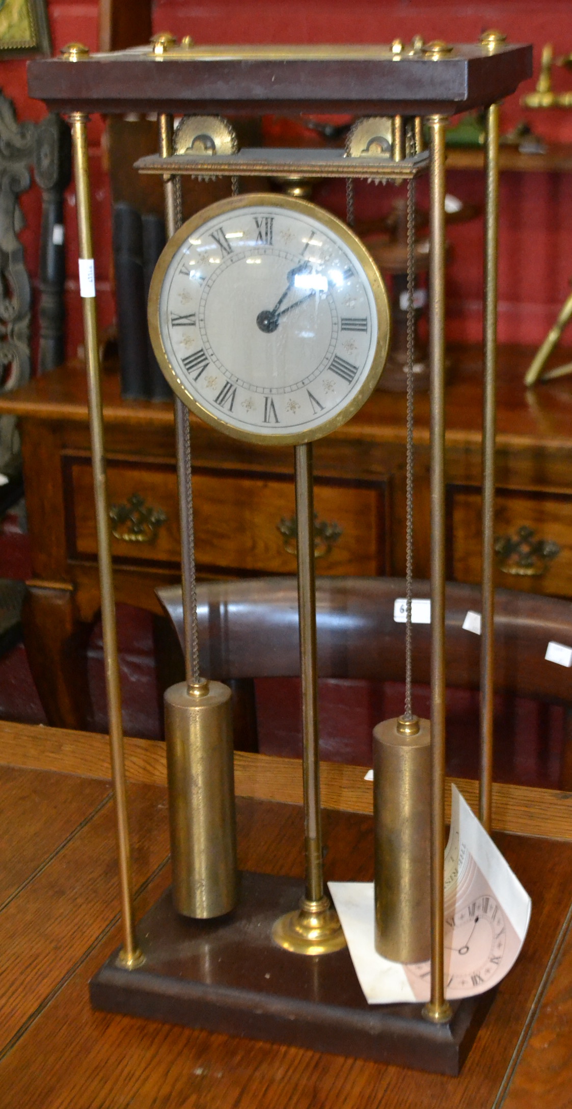 A Franklin Mint novelty clock, The Rising Works Clock, in mahogany and ...