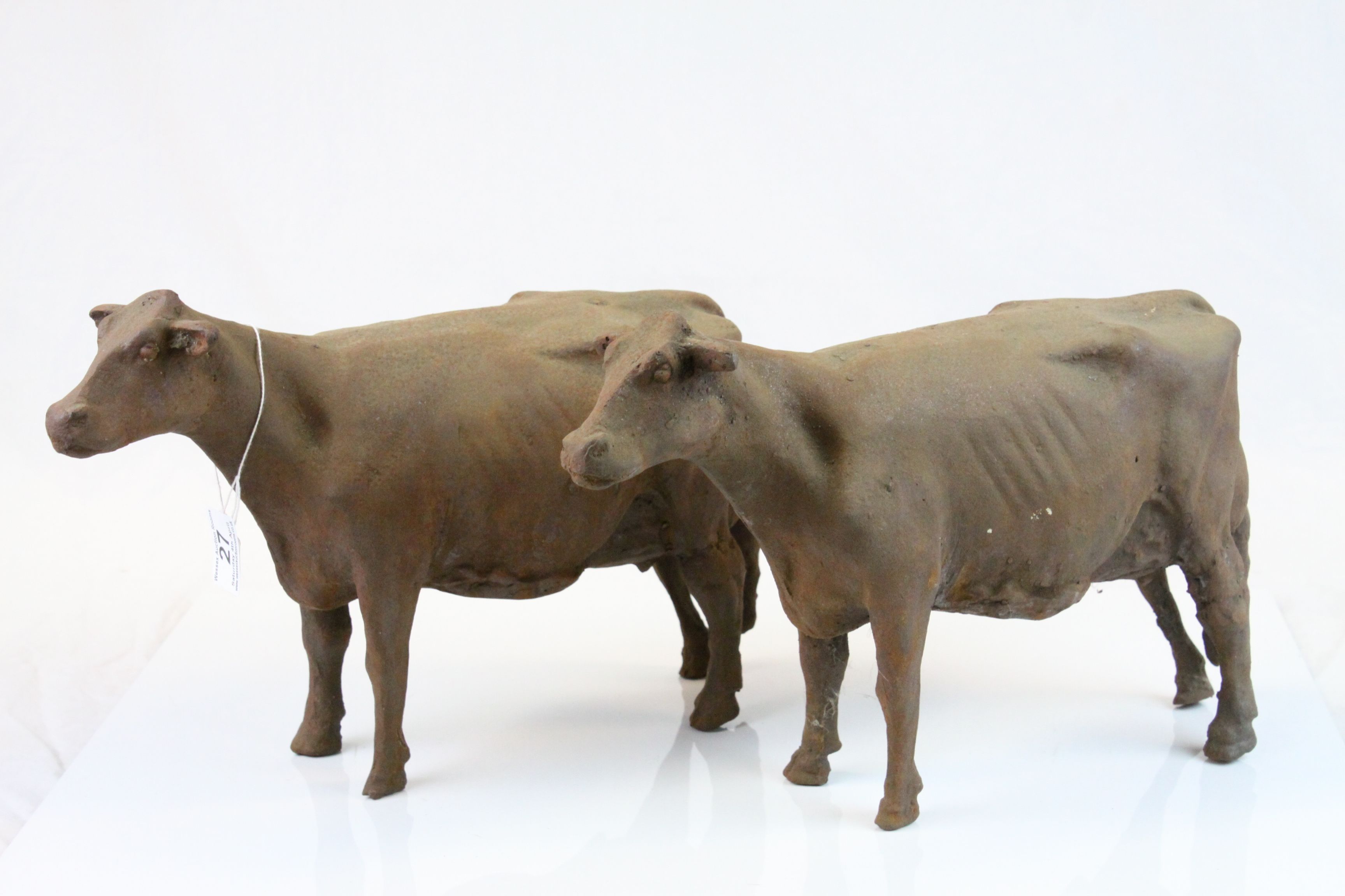 Two Cast Iron Models of Cows, each 25cms high